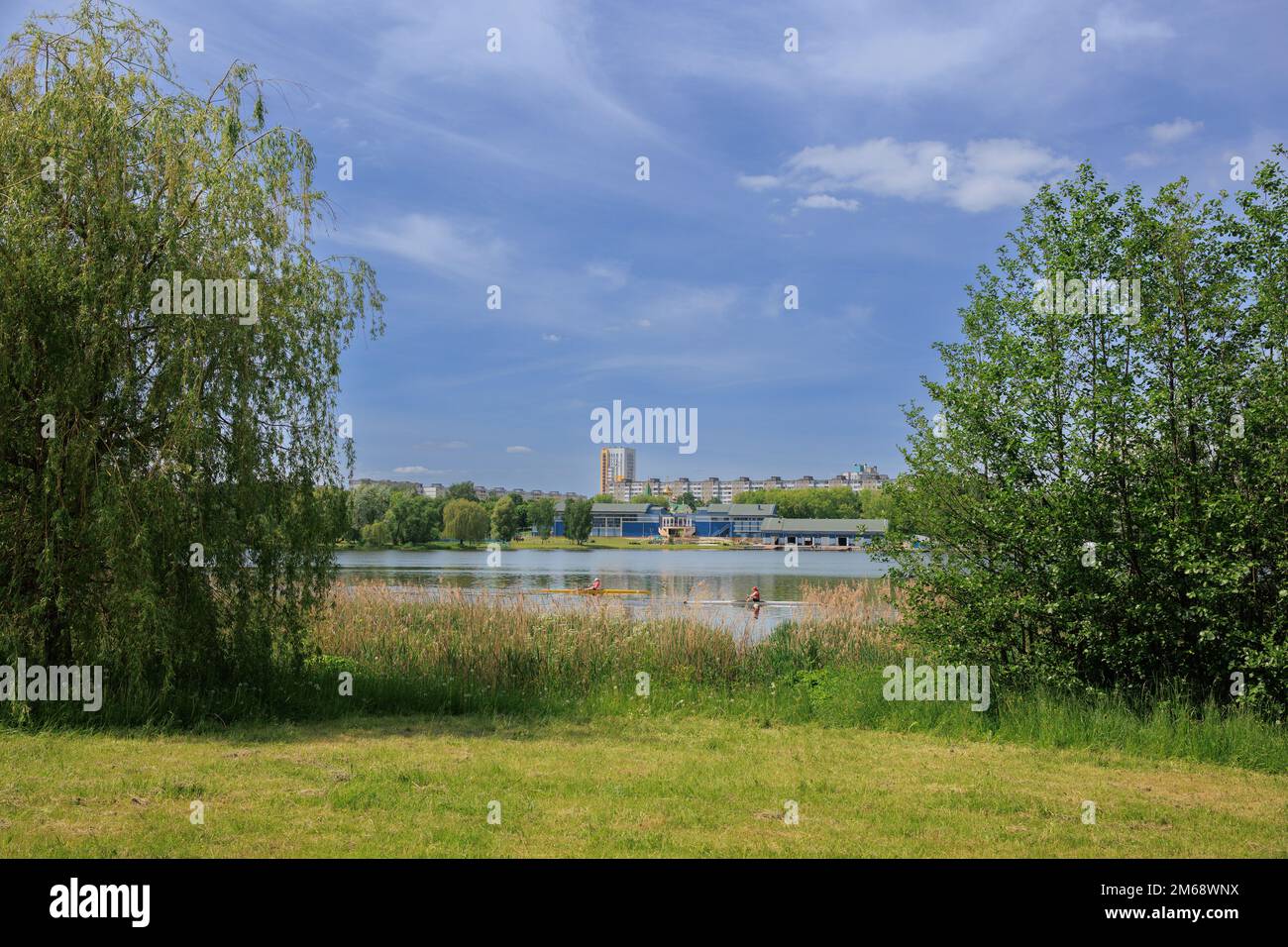 Buildings and houses standing on the shore of a lake, river or sea ...