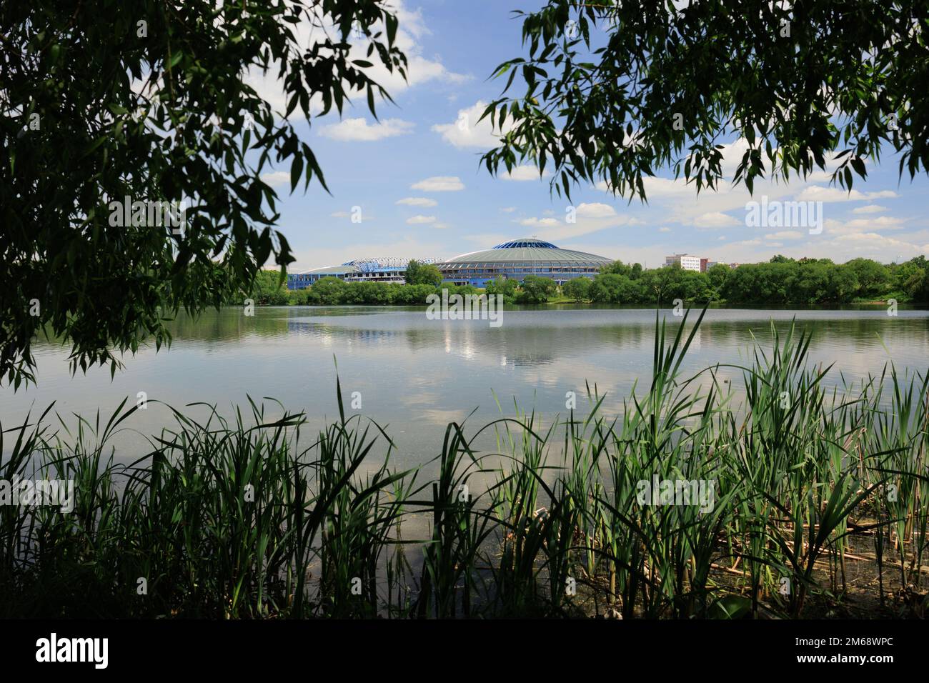 Buildings and houses standing on the shore of a lake, river or sea ...