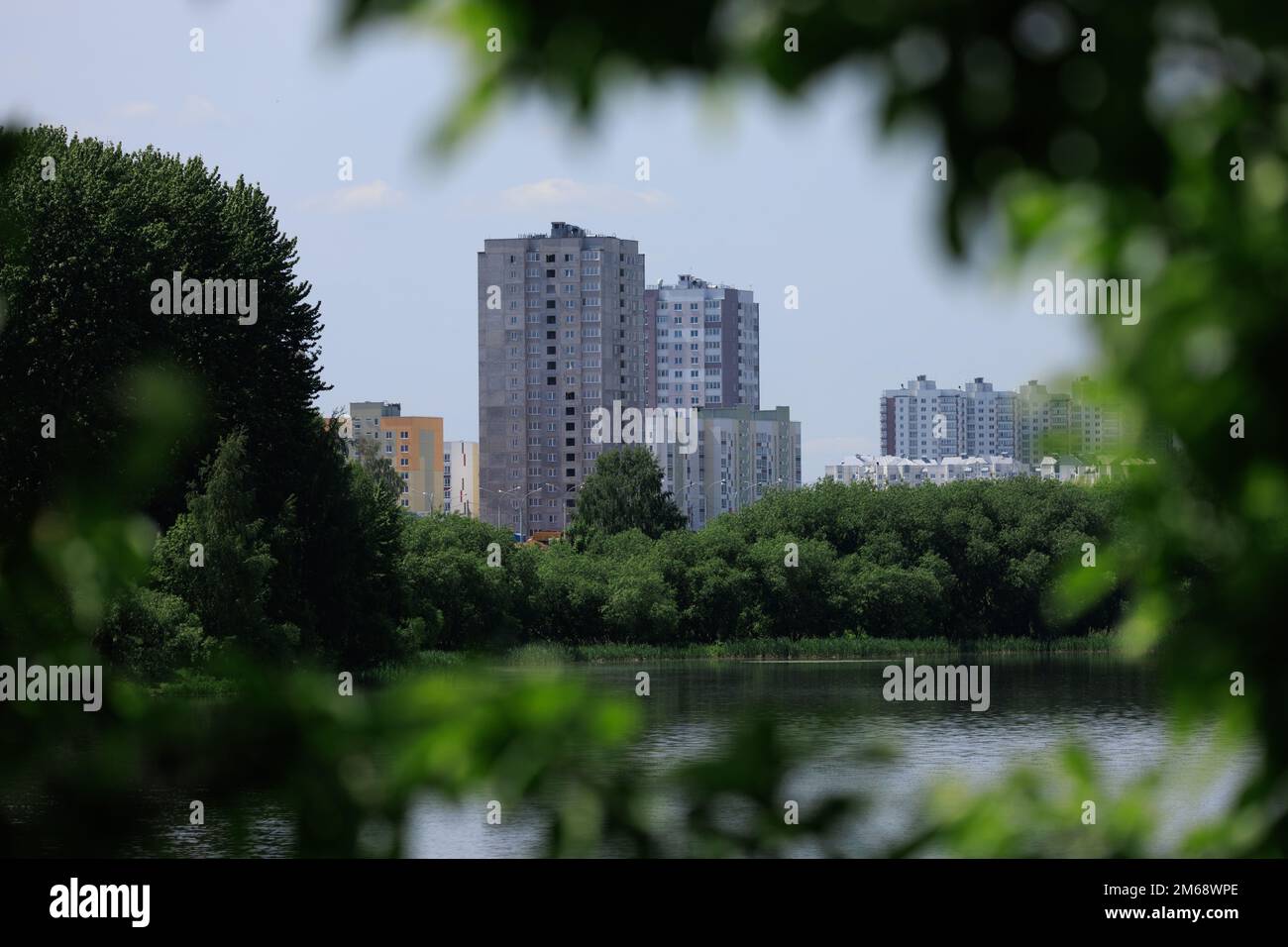 Buildings and houses standing on the shore of a lake, river or sea ...