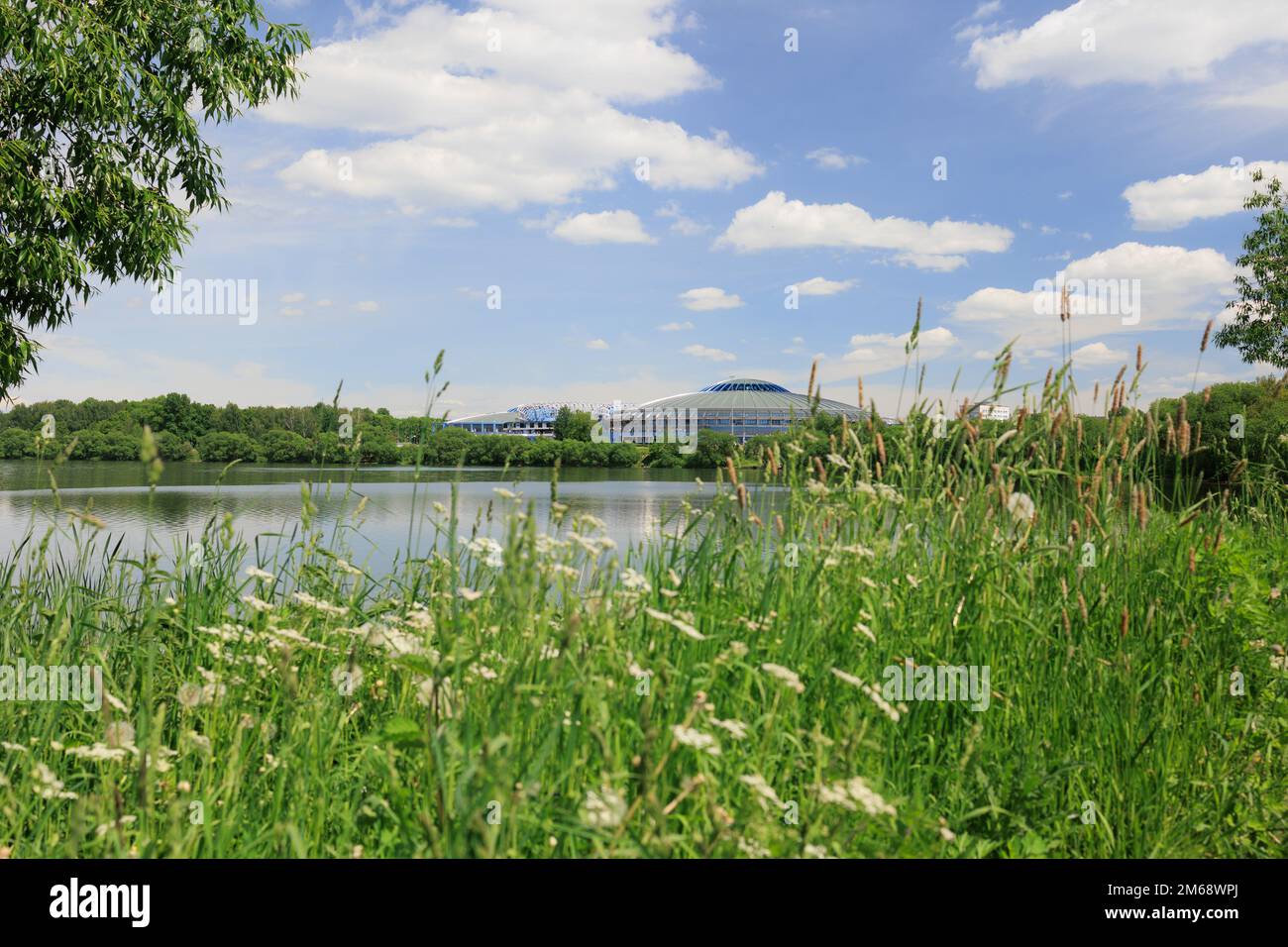 Buildings and houses standing on the shore of a lake, river or sea ...