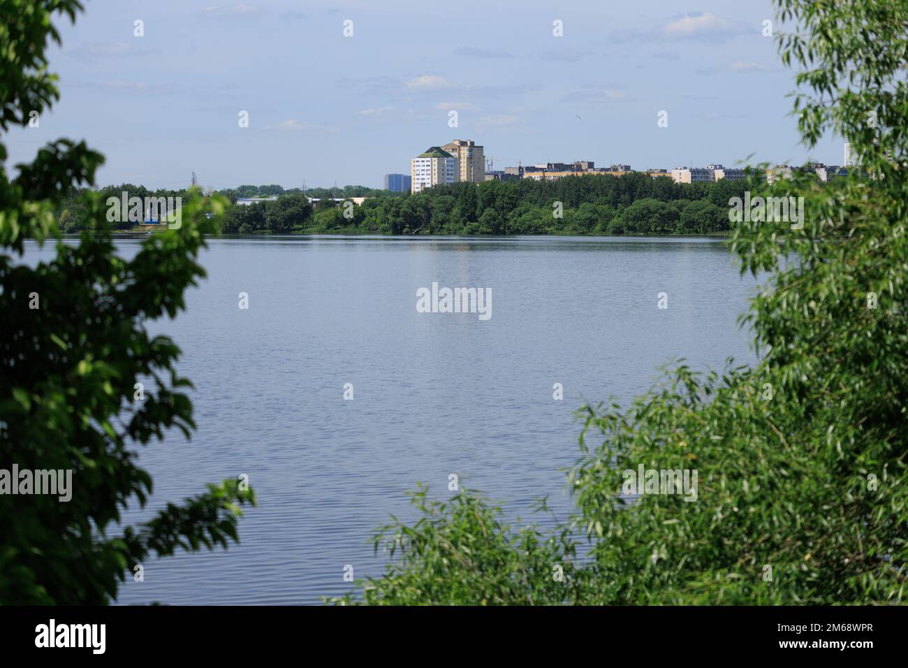 Buildings and houses standing on the shore of a lake, river or sea ...