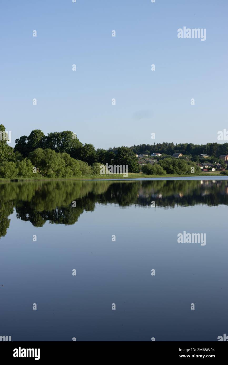 Buildings and houses standing on the shore of a lake, river or sea ...