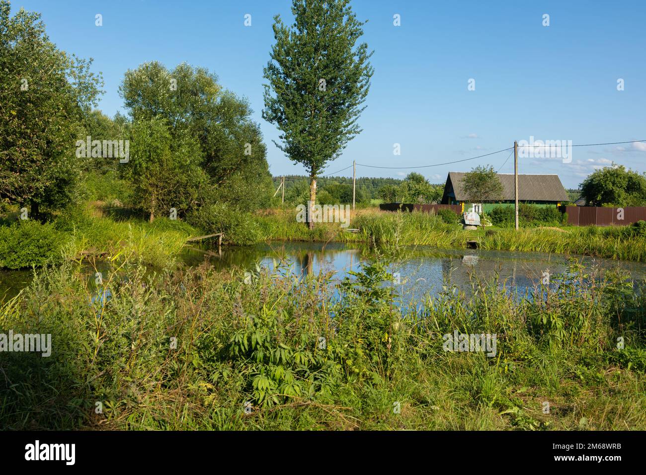Buildings and houses standing on the shore of a lake, river or sea ...