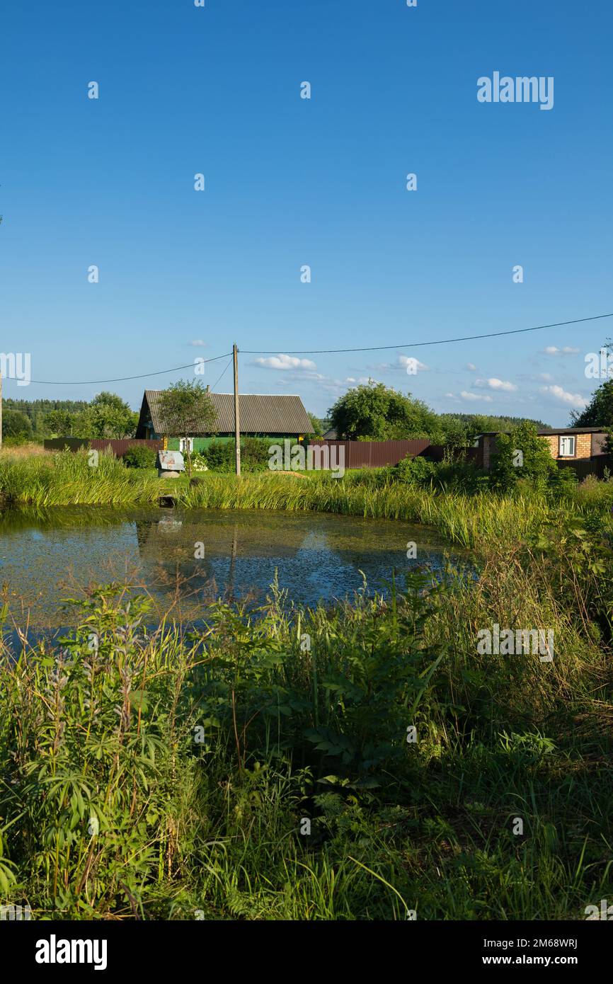 Buildings and houses standing on the shore of a lake, river or sea ...