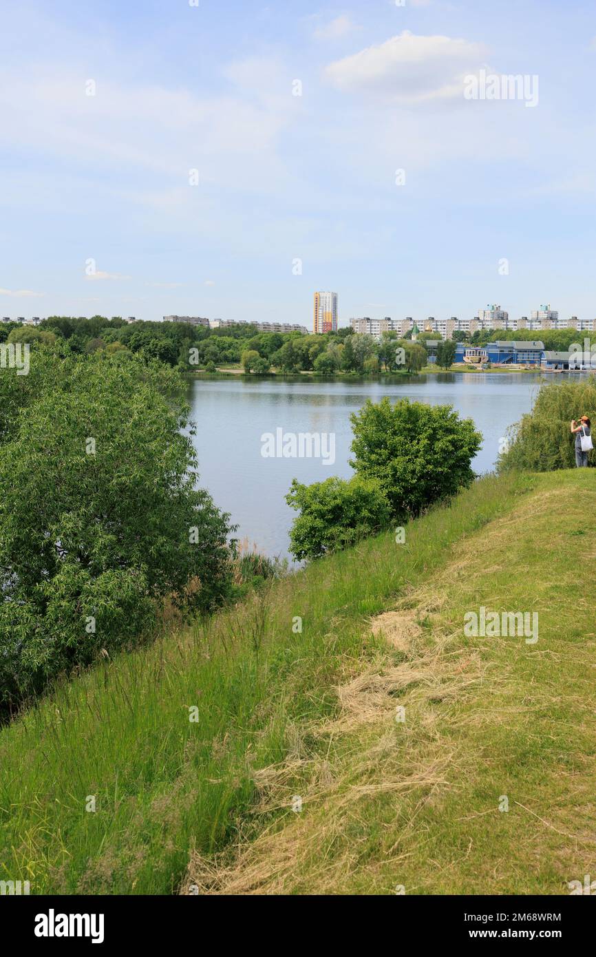 Buildings and houses standing on the shore of a lake, river or sea ...