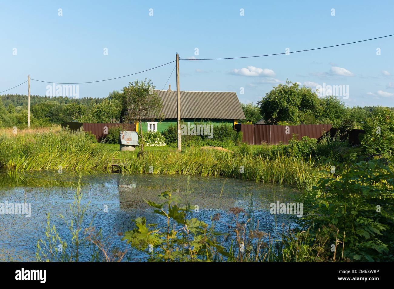 Buildings and houses standing on the shore of a lake, river or sea ...