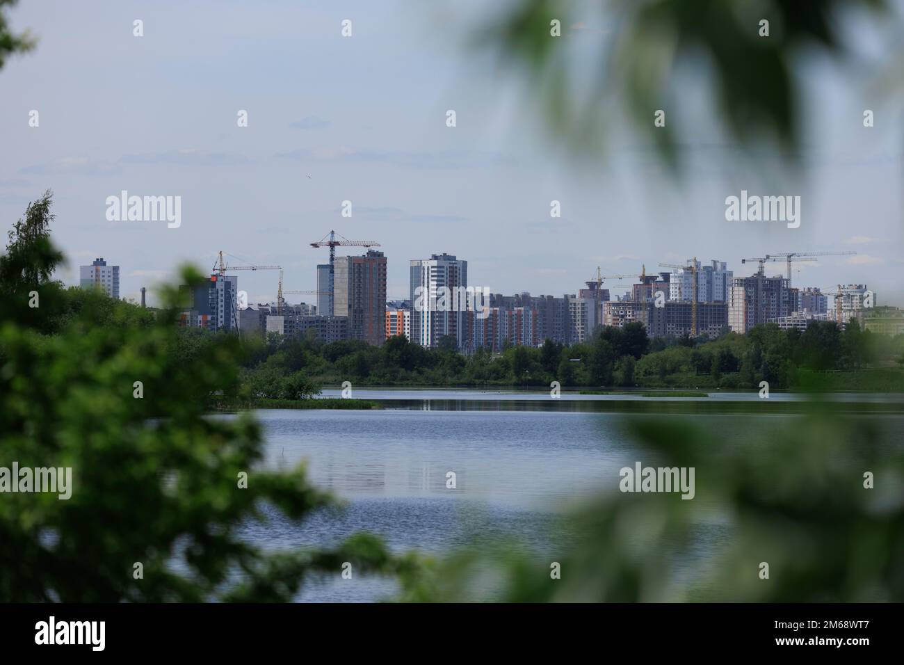 Buildings and houses standing on the shore of a lake, river or sea ...