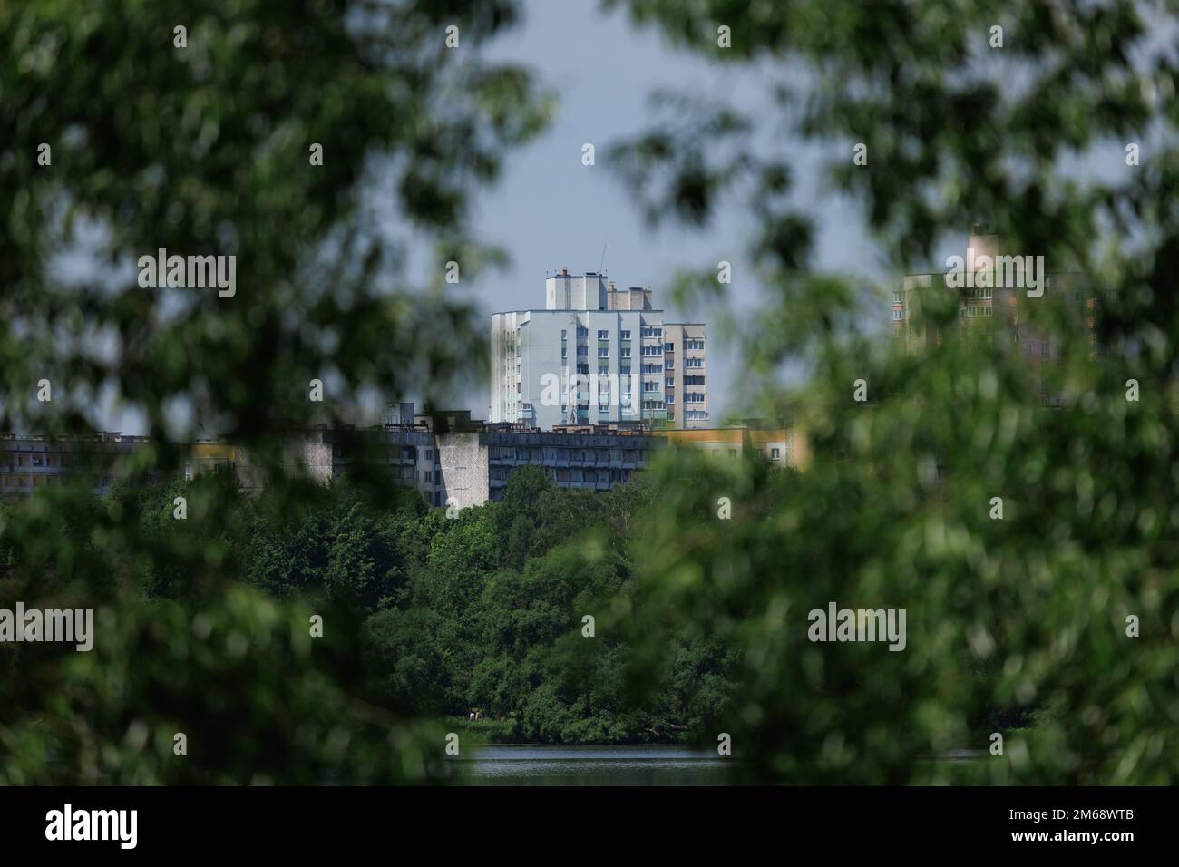 Buildings and houses standing on the shore of a lake, river or sea ...