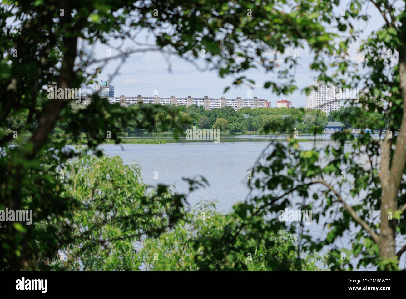 Buildings and houses standing on the shore of a lake, river or sea ...