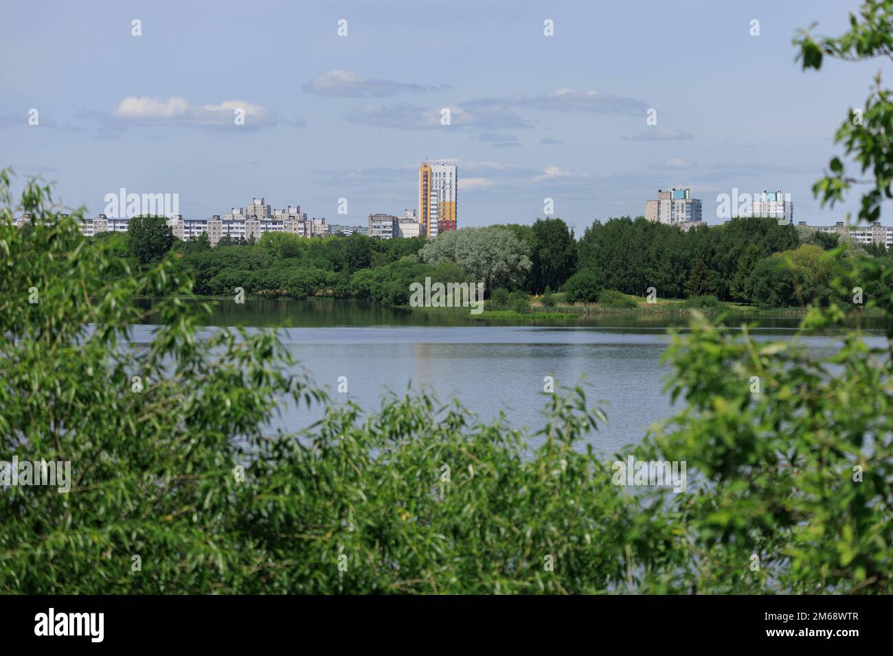 Buildings and houses standing on the shore of a lake, river or sea ...