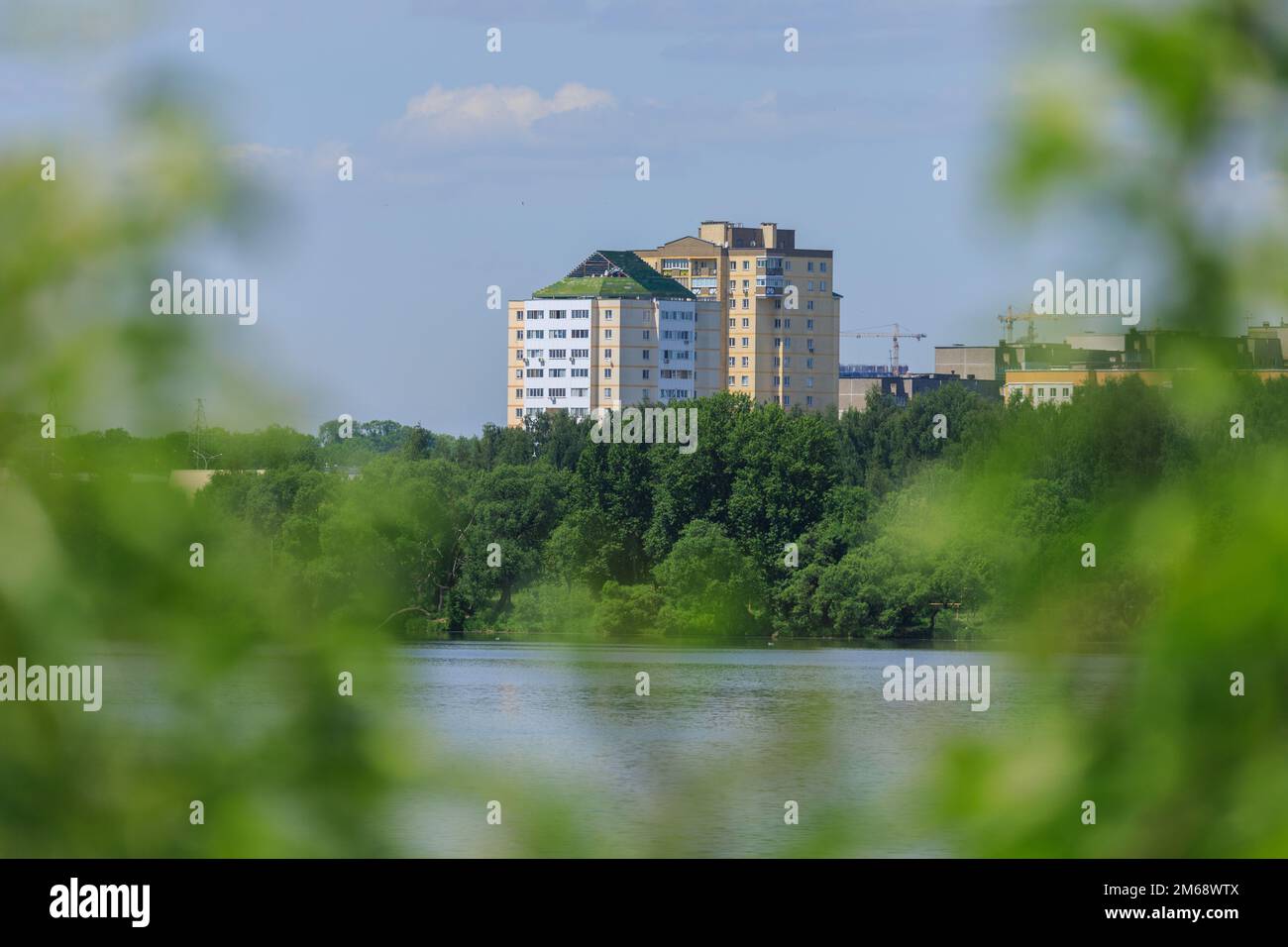 Buildings and houses standing on the shore of a lake, river or sea ...