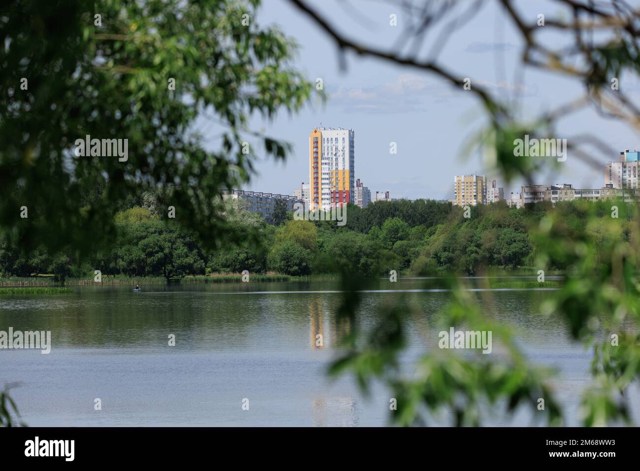 Buildings and houses standing on the shore of a lake, river or sea ...