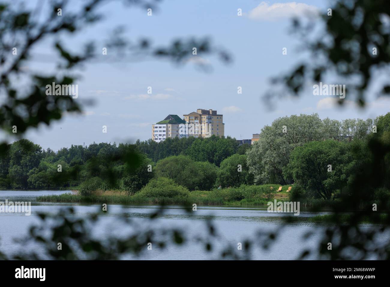 Buildings and houses standing on the shore of a lake, river or sea ...
