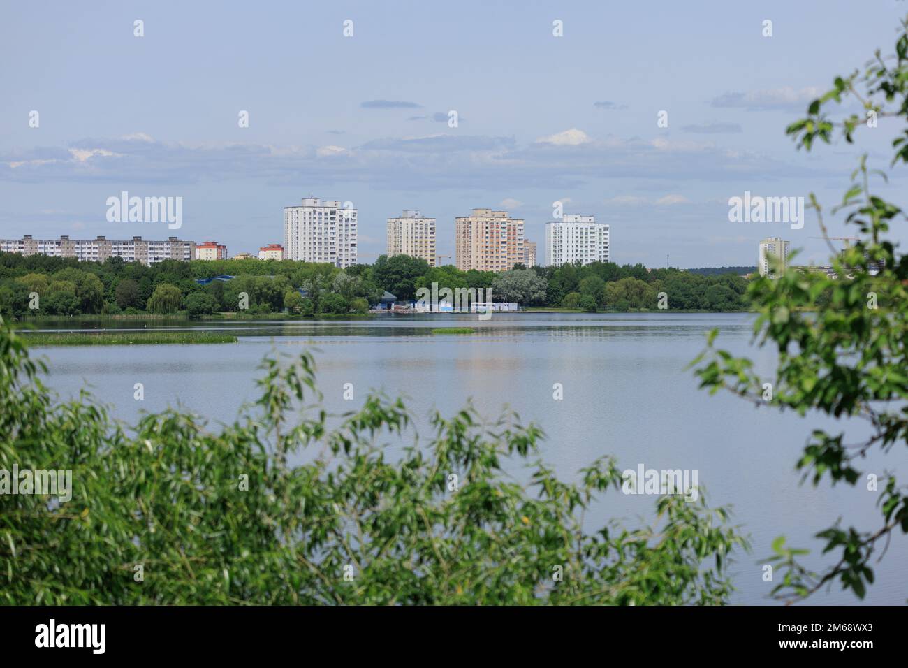 Buildings and houses standing on the shore of a lake, river or sea ...