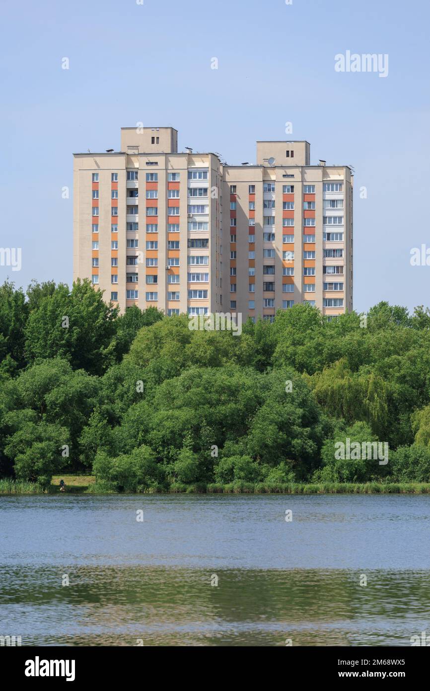 Buildings and houses standing on the shore of a lake, river or sea ...