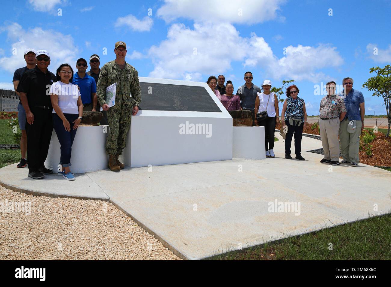 Staff from Marine Corps Base Camp Blaz pose for a photo with members ...