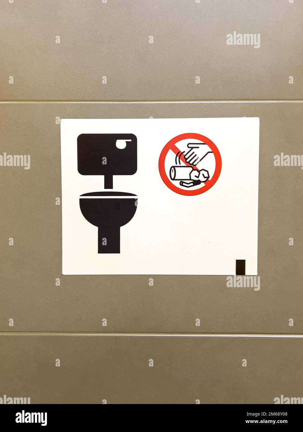 A vertical shot of the toilet sign with garbage prohibited symbol on ...