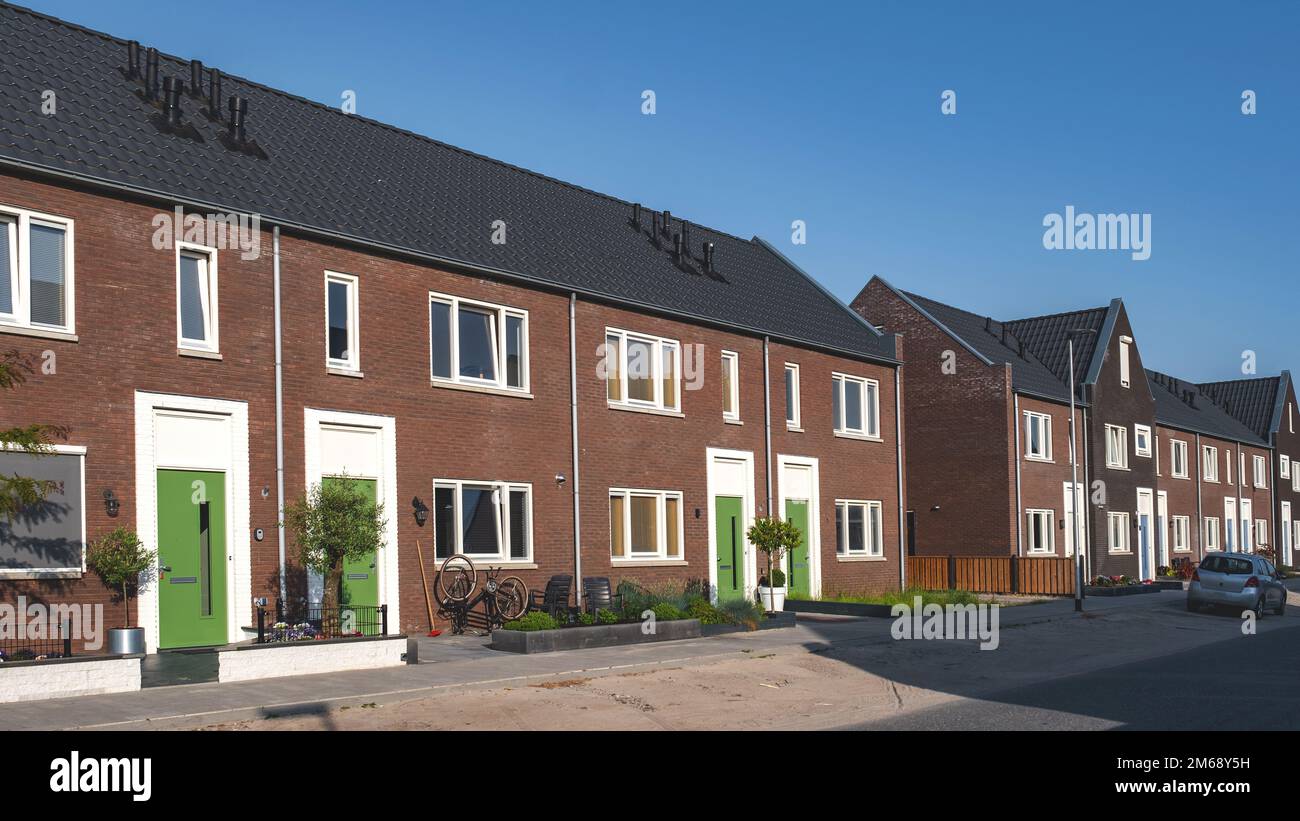 Dutch Suburban area with modern family houses, newly build modern ...