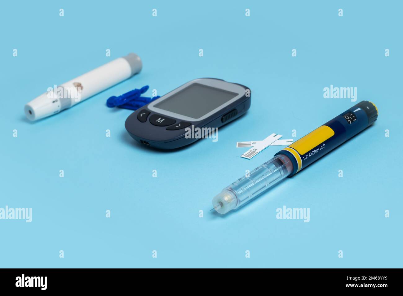 Measuring blood sugar. Glucometer, insulin pen, lancet and test strip ...