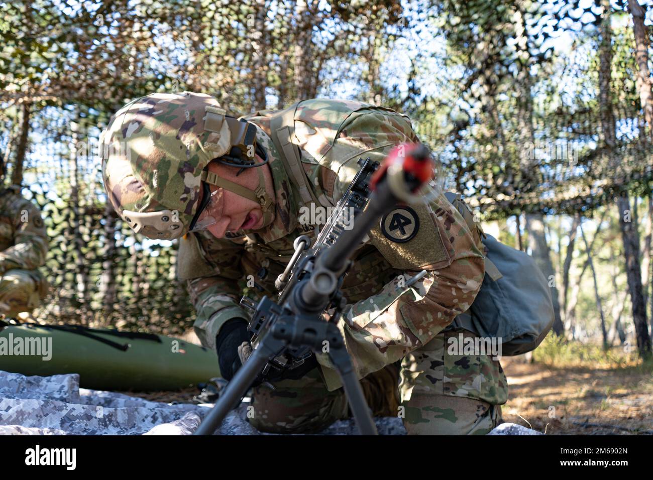 New Jersey Army National Guard Sgt. Jared Fillmore reassembles an M249 ...