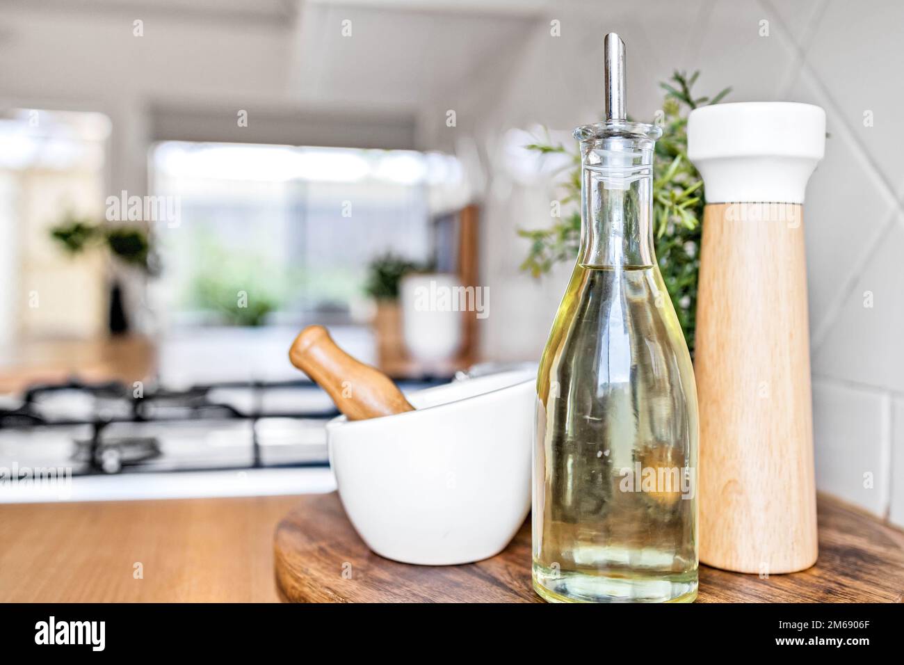 Still life with olive oil, salt grinder and mortar with pestle Stock ...