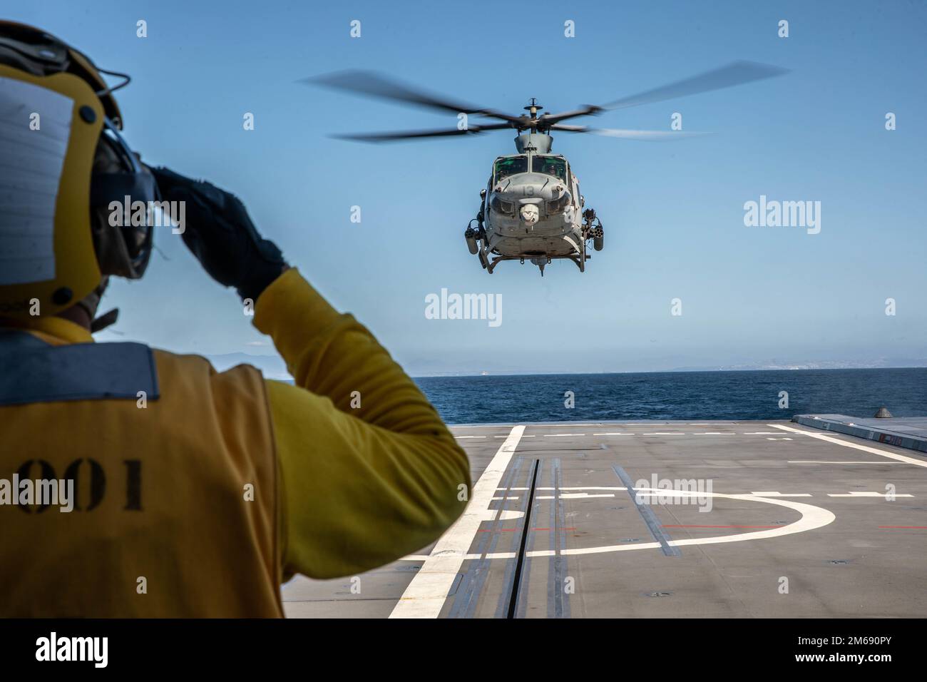 A U.S. Navy Sailor with USS Michael Monsoor (DDG 1001), a Zumwalt-class ...