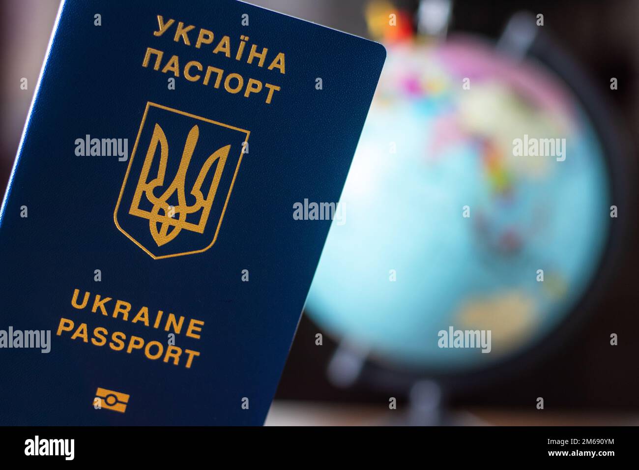 Ukraine, passporton the background of the globe. Ukrainian passports in ...