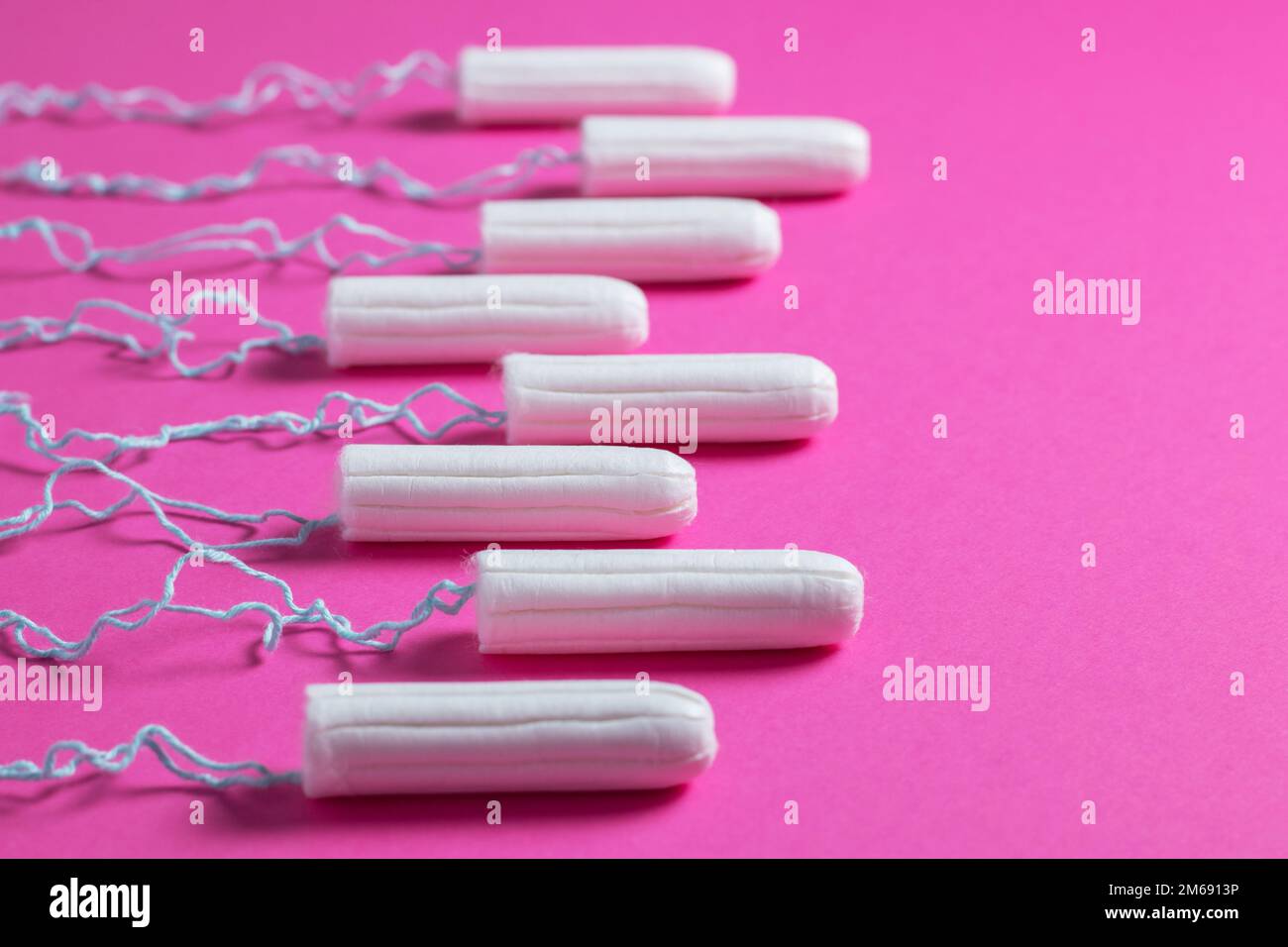 Menstrual period concept. Woman hygiene protection. Cotton tampons on ...