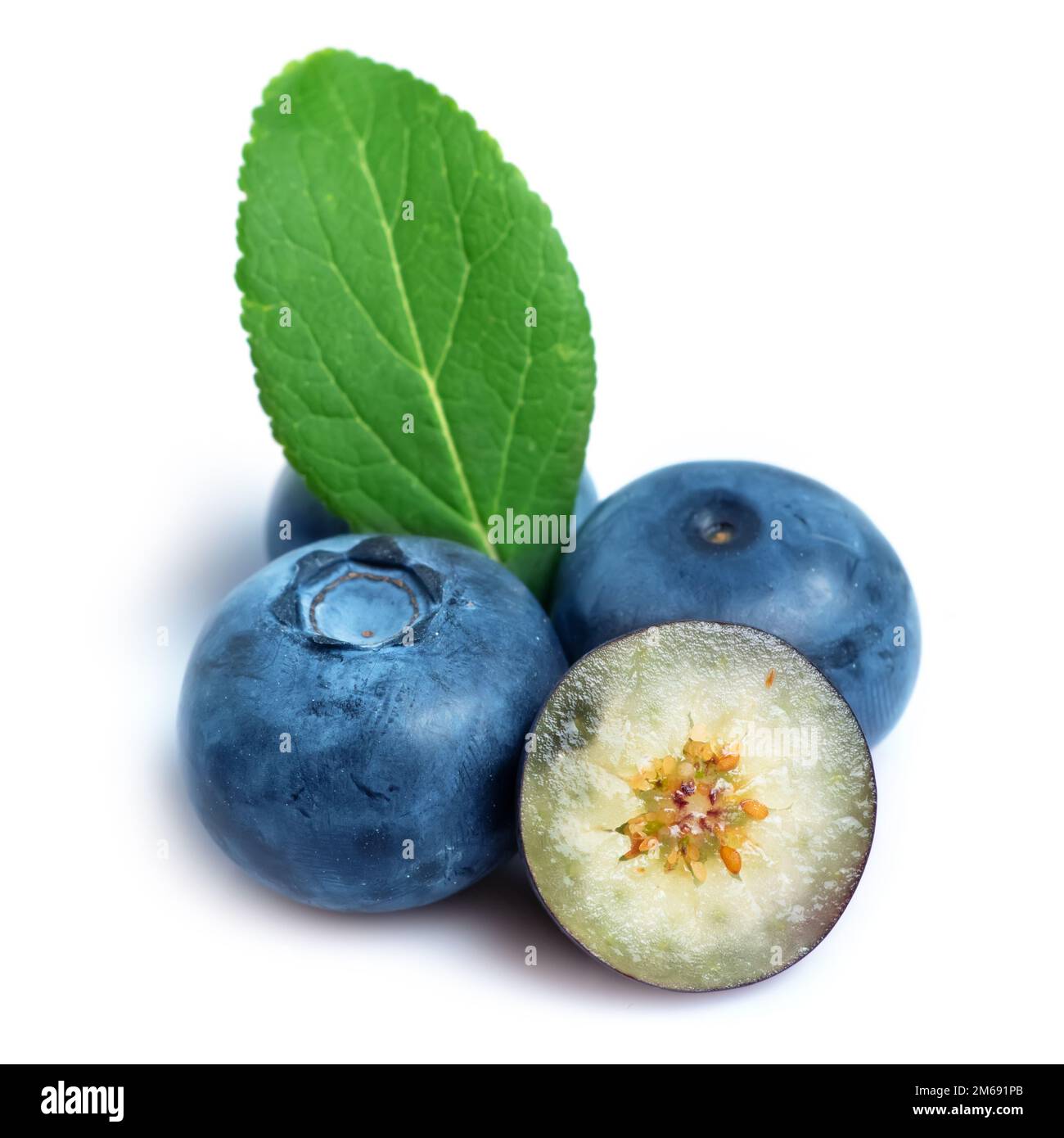 fresh Blueberries with cut in half and green leaves isolated on white ...