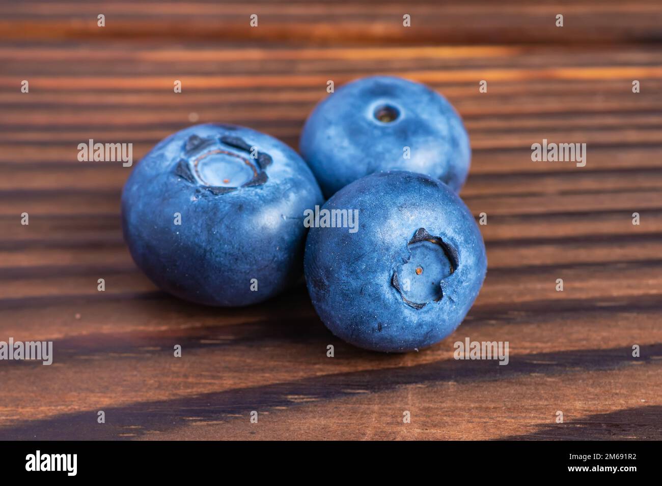 Blueberry. Blueberries set on wooden background. Bilberry Stock Photo ...