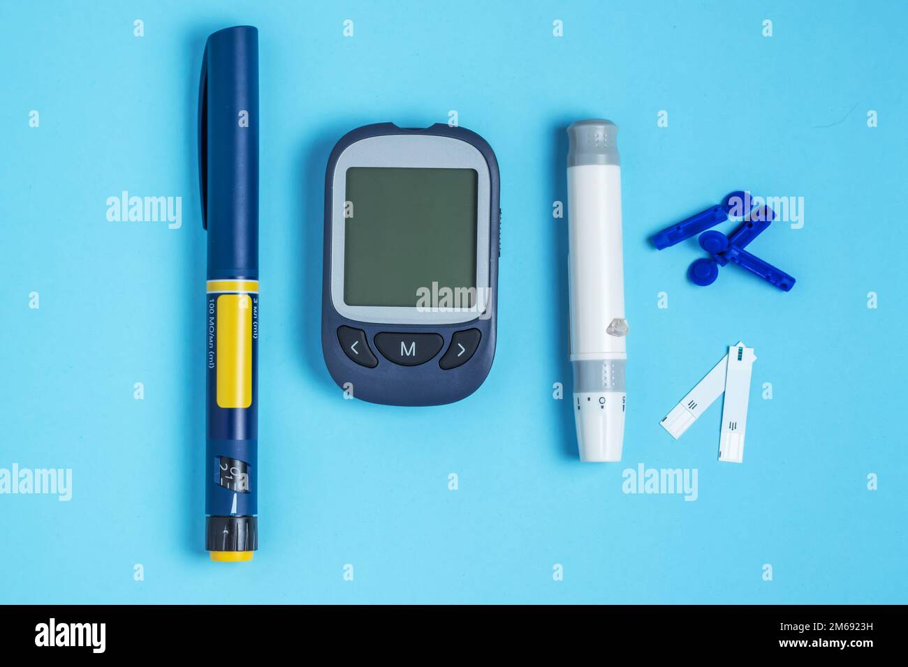 Measuring blood sugar. Glucometer, insulin pen, lancet and test strip ...