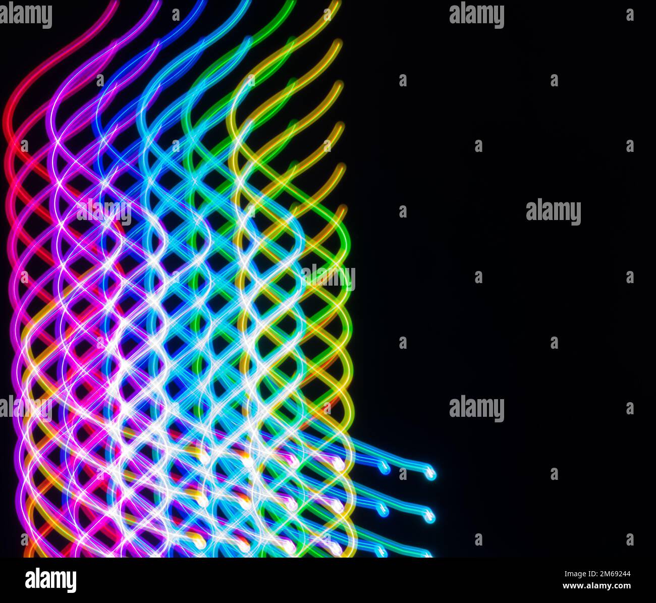 Beautiful light painting designs on dark black background. Long ...