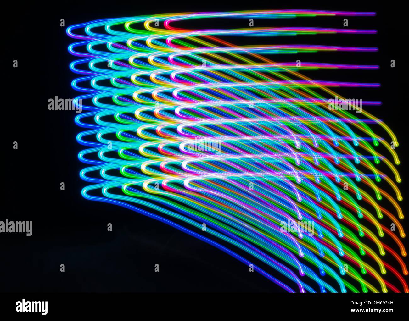 Beautiful light painting designs on dark black background. Long ...