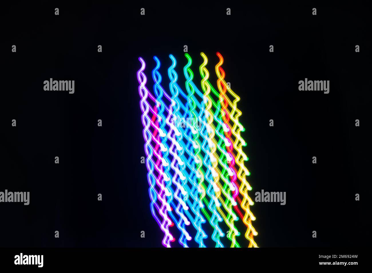 Beautiful light painting designs on dark black background. Long ...