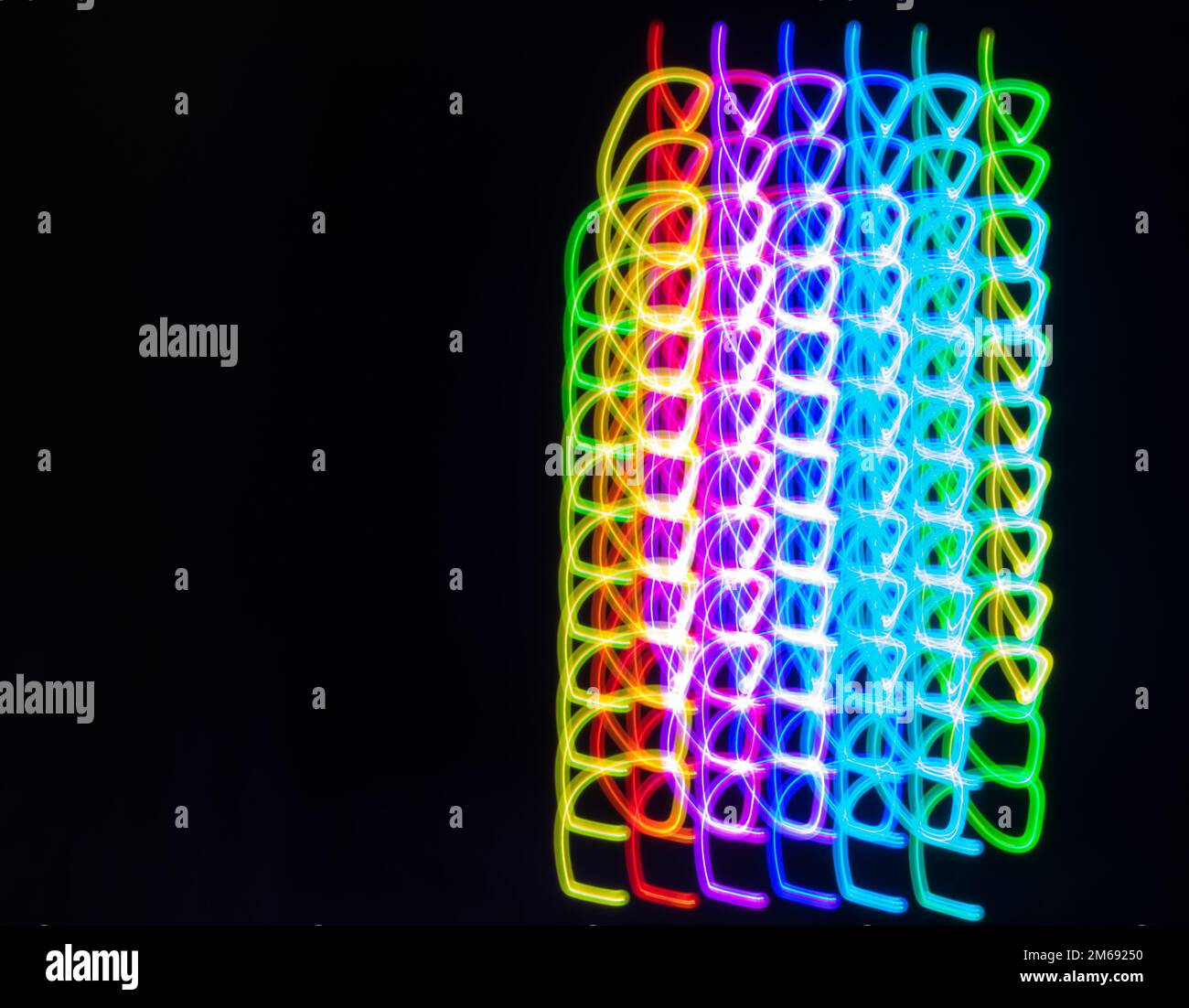 Beautiful light painting designs on dark black background. Long ...