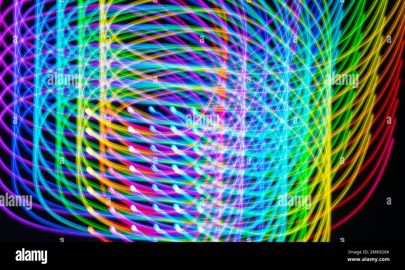 Beautiful light painting designs on dark black background. Long ...