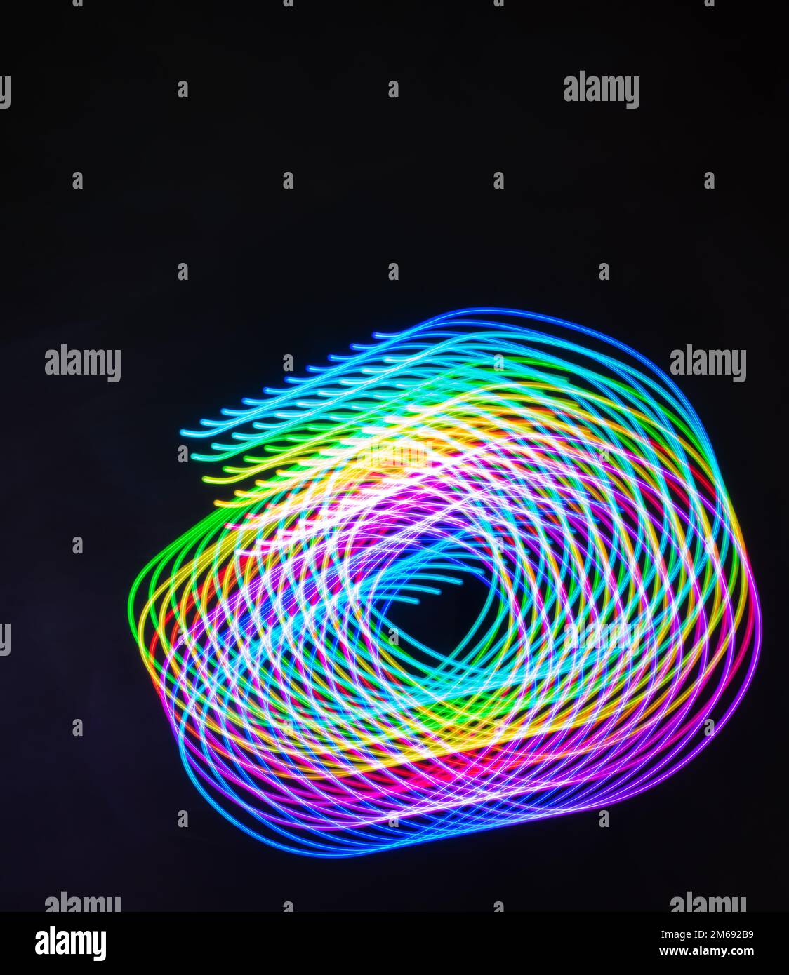 Beautiful light painting designs on dark black background. Long ...