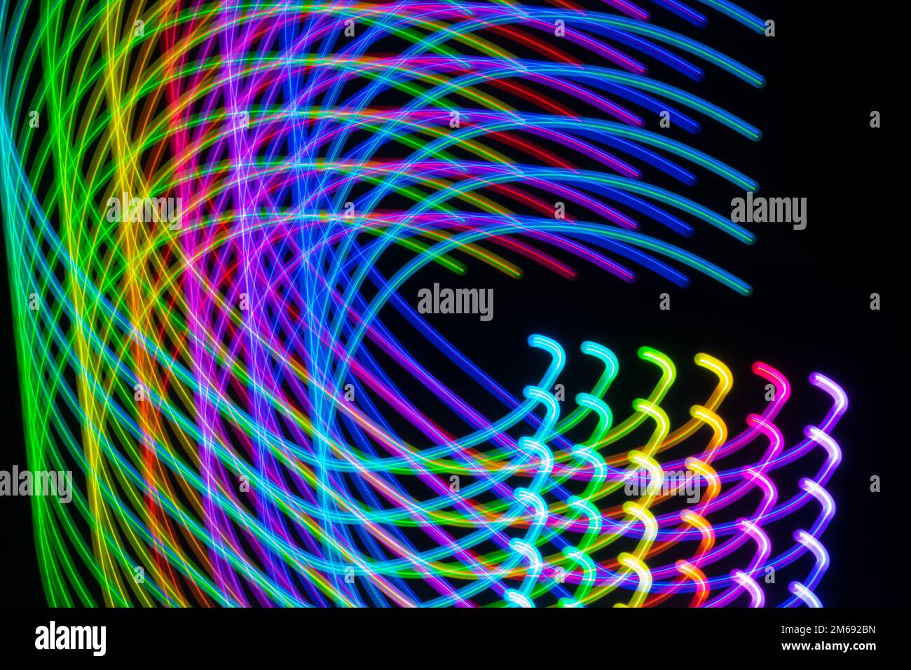 Beautiful light painting designs on dark black background. Long ...