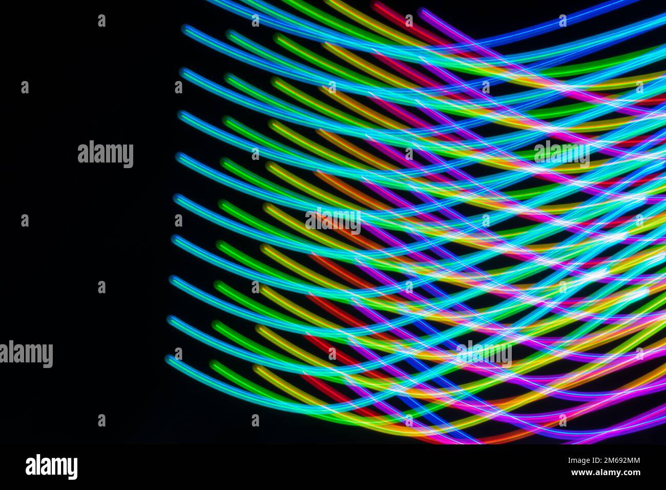 Beautiful light painting designs on dark black background. Long ...