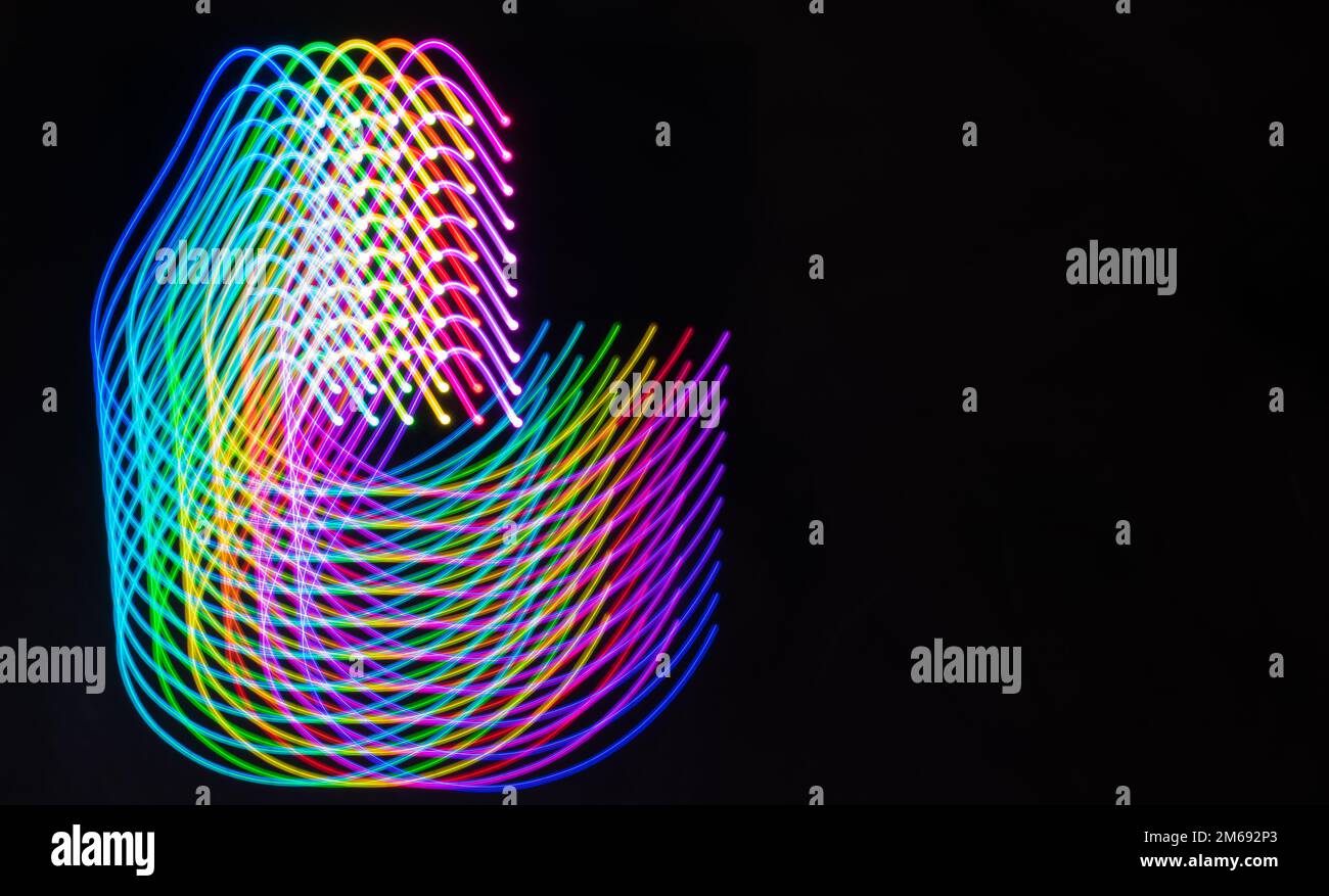Beautiful light painting designs on dark black background. Long ...