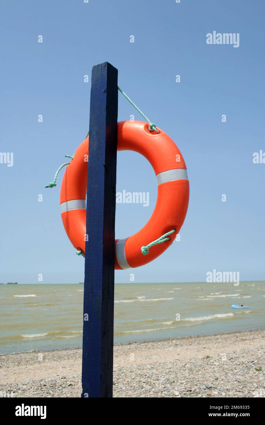 Ring-buoy on the beach Stock Photo - Alamy