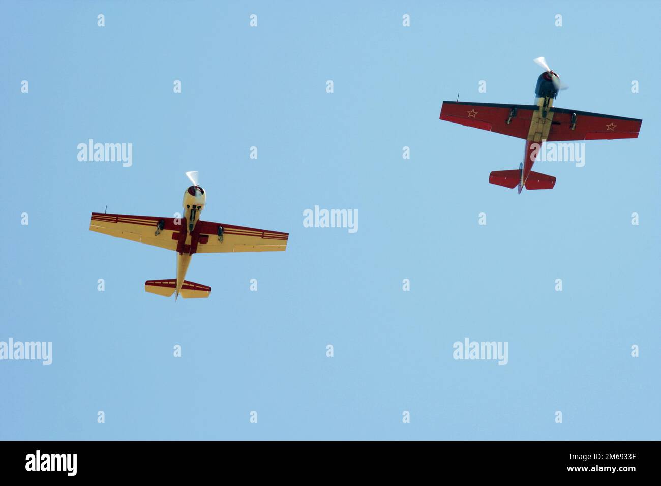 Two propeller-driven airplanes on clear sky background 2 Stock Photo ...