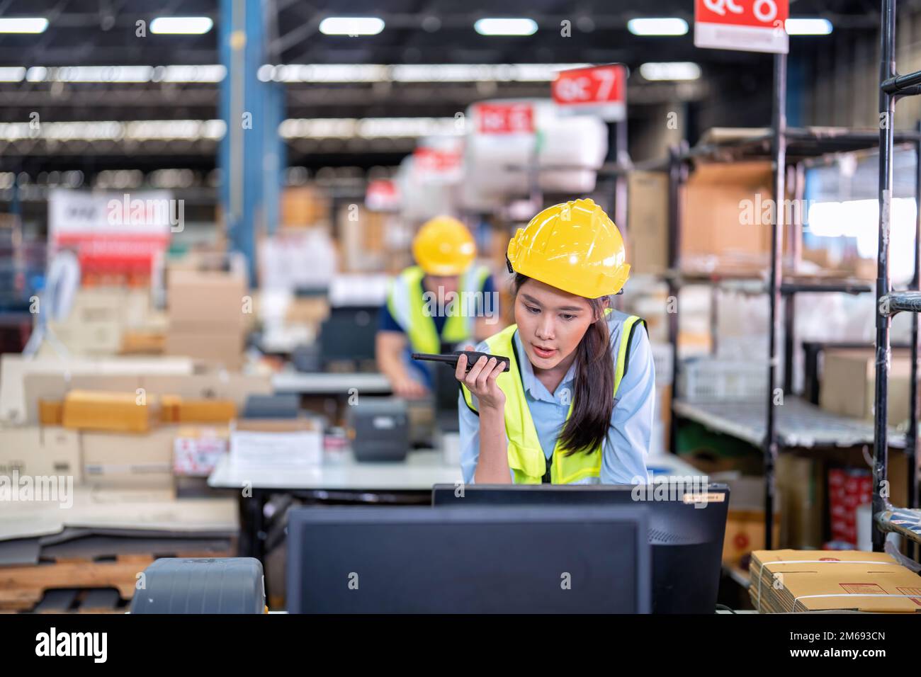 Worker working in the large depot storage warehouse concentrate check ...