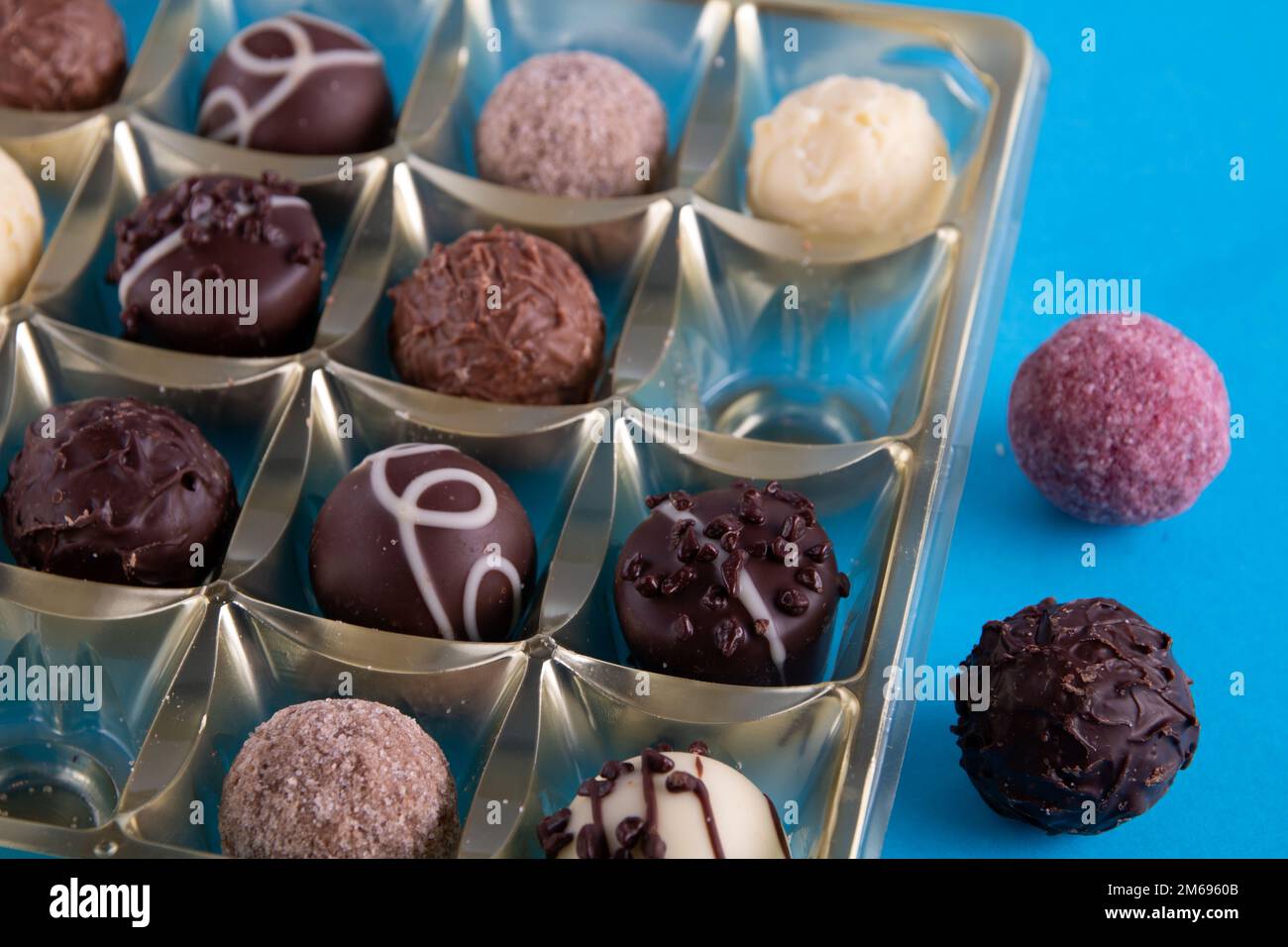photo different round chocolate candies in a package Stock Photo - Alamy