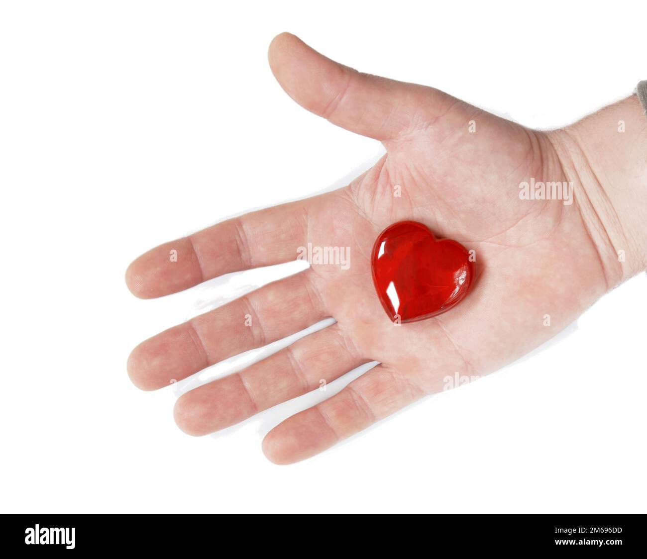 Heart on hand Stock Photo - Alamy