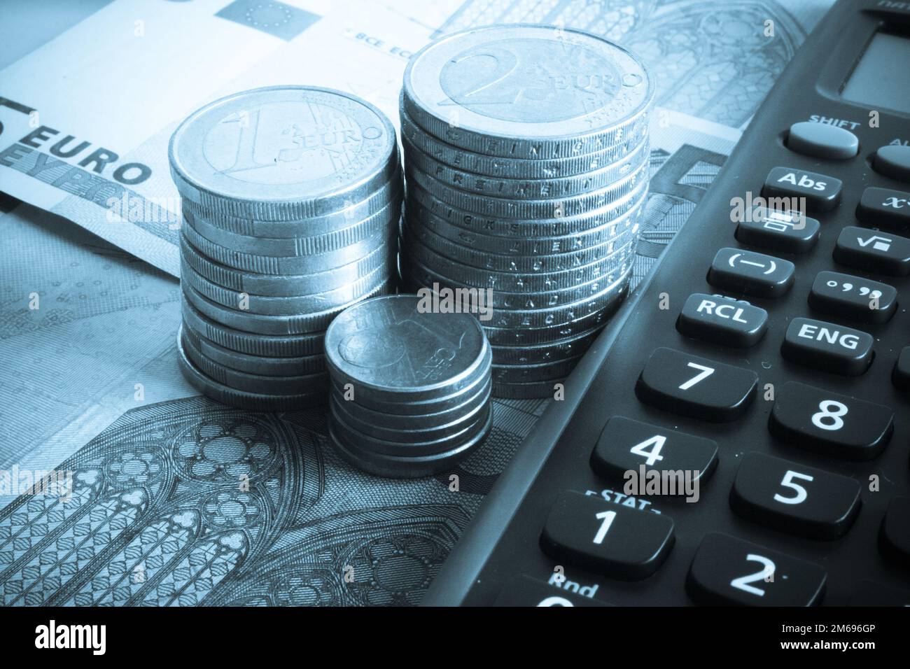 Cash and calculators Stock Photo - Alamy