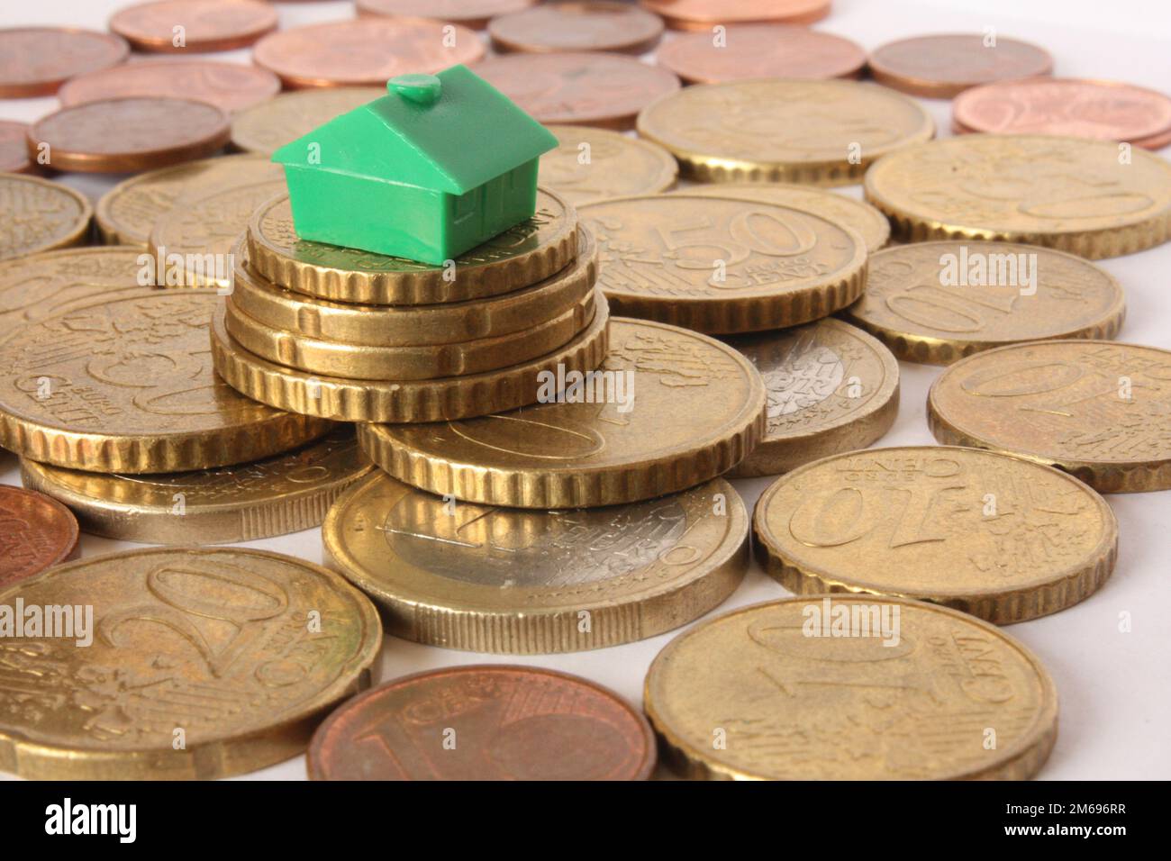 House on money pile Stock Photo - Alamy