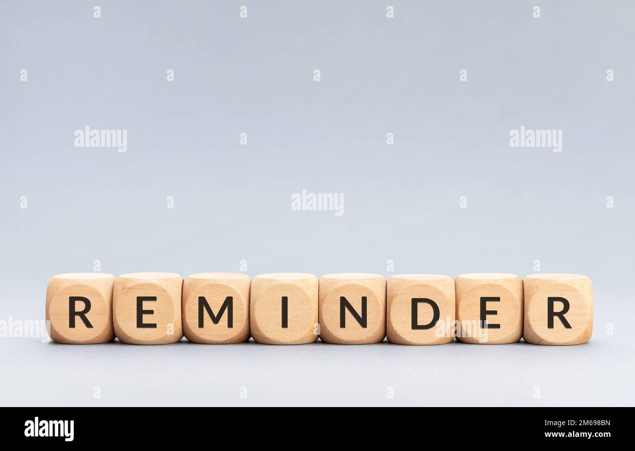 Reminder word on wooden blocks on gray background. Copy space Stock ...