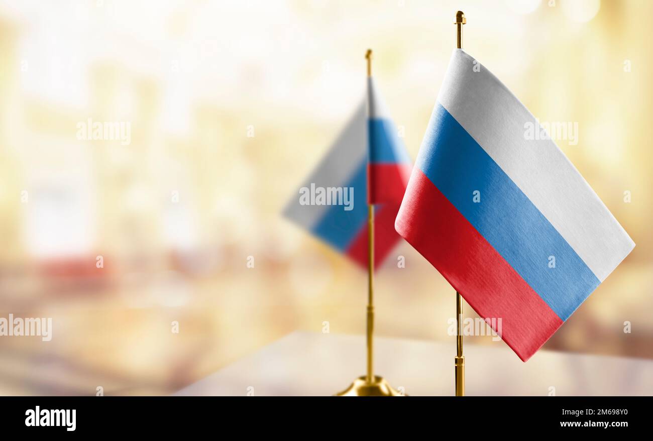 Small flags of the Russia on an abstract blurry background Stock Photo ...