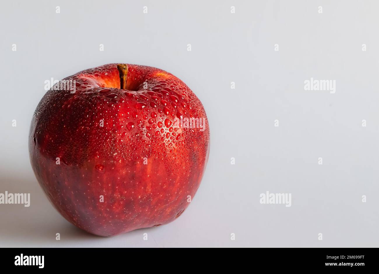 Beautiful close up of red apple on white background with blurred ...